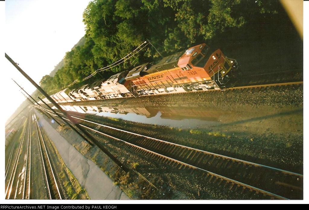 BNSF 7434 as she gets close to me on 26 St. Bridge over Argentine Yard.